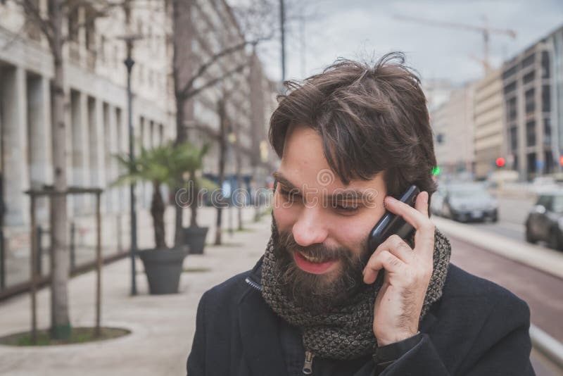 Young Handsome Bearded Man Talking on Phone Stock Photo - Image of ...