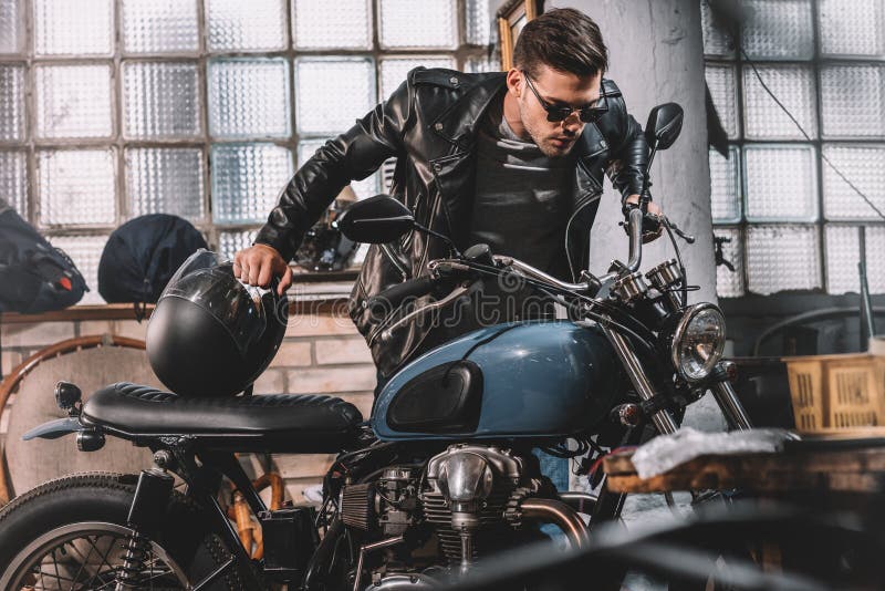 Young Handsome Biker in Black Leather Jacket with Classic Motorcycle ...