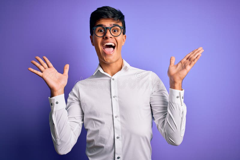 Young Handsome Business Man Wearing Shirt And Glasses Over Isolated