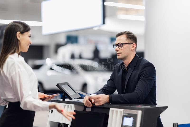 Handsome Receptionist Standing at Reception Desk Stock Photo - Image of ...