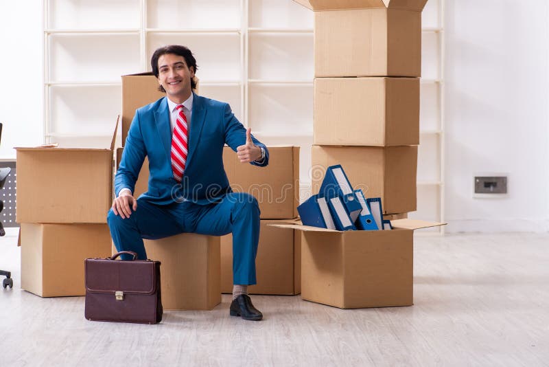 The Young Handsome Businessman Moving To New Workplace Stock Photo ...