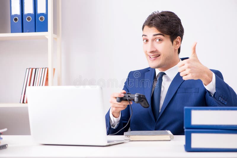 Young Handsome Businessman Playing Computer Games at Work Office Stock ...