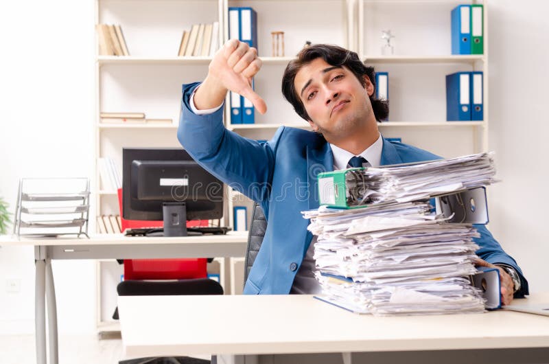 The Young Handsome Busy Employee Sitting in Office Stock Photo - Image ...