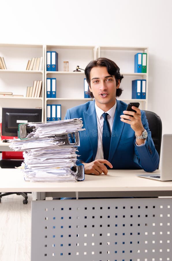 The Young Handsome Busy Employee Sitting in Office Stock Image - Image ...
