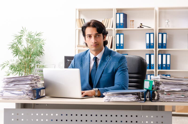 The Young Handsome Busy Employee Sitting in Office Stock Photo - Image ...