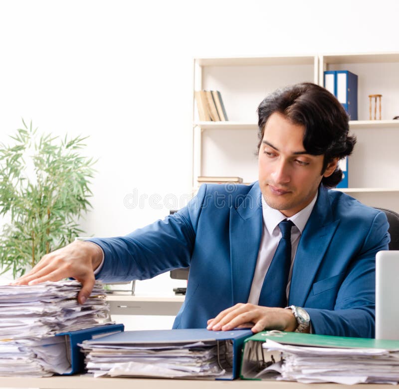 Young Handsome Busy Employee Sitting in Office Stock Image - Image of ...