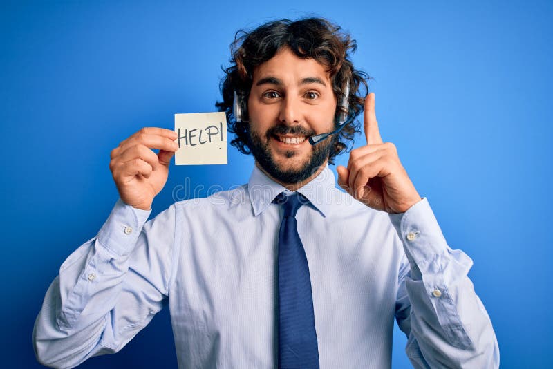 Young Handsome Call Center Agent Man with Beard Working Using Headset ...