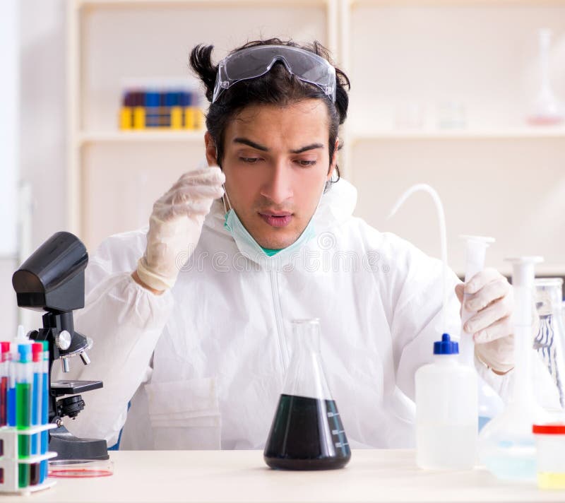 Young Handsome Chemist Working in the Lab Stock Image - Image of pharmaceutical, beaker: 287521619