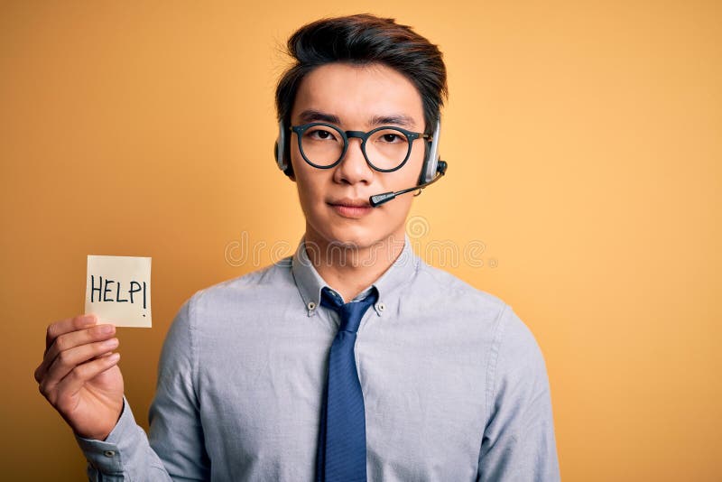 Young Handsome Chinese Call Center Agent Man Overworked Using Headset ...