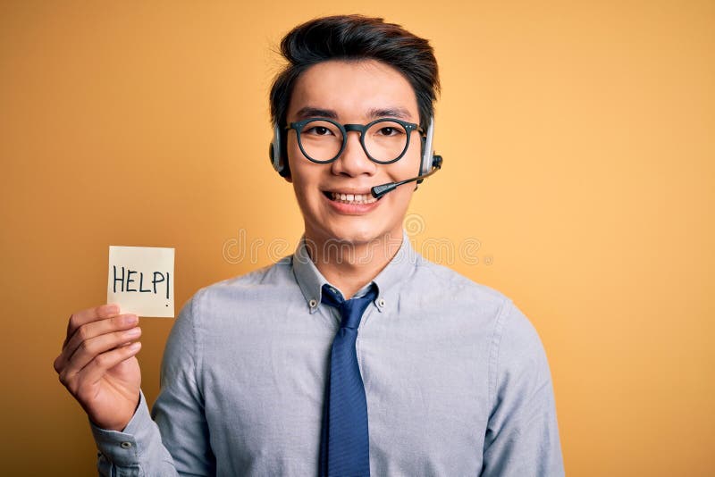 Young Handsome Chinese Call Center Agent Man Overworked Using Headset ...