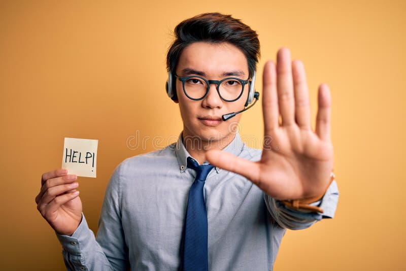 Young Handsome Chinese Call Center Agent Man Overworked Using Headset ...