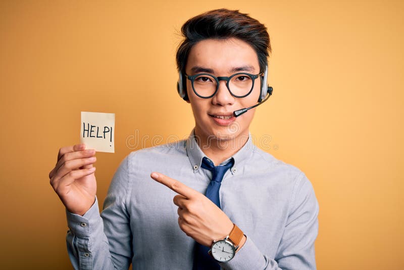 Young Handsome Chinese Call Center Agent Man Overworked Using Headset ...