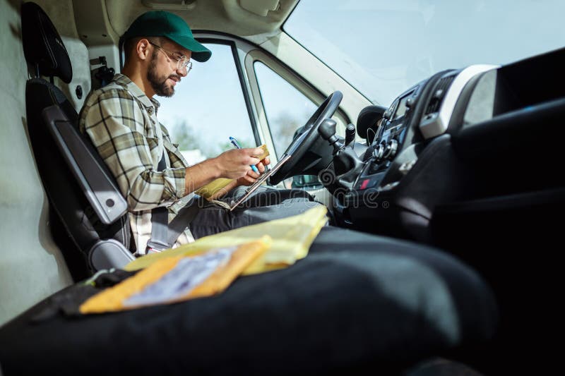 Handsome Delivery Guy Getting His Deliveries Ready Stock Photo - Image ...