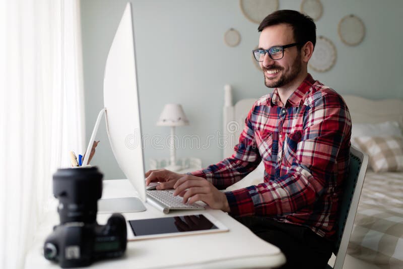 Young Handsome Designer Working on Project on Computer Stock Image ...