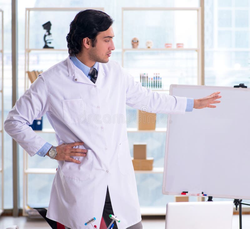 Young Handsome Doctor in Front of Whiteboard Stock Photo - Image of ...