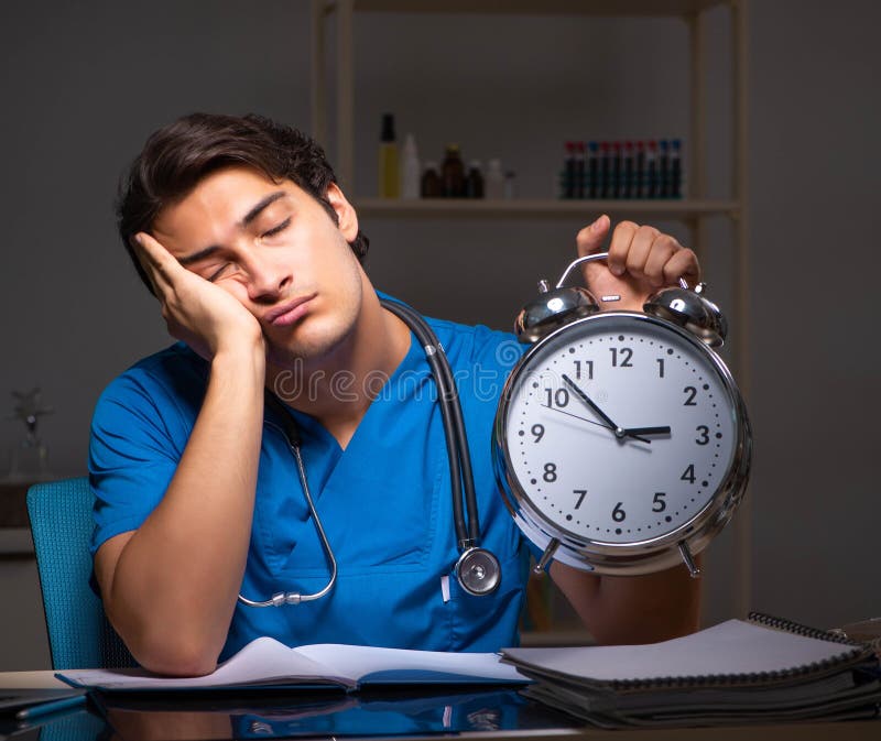 Young Handsome Doctor Working Night Shift in Hospital Stock Image ...