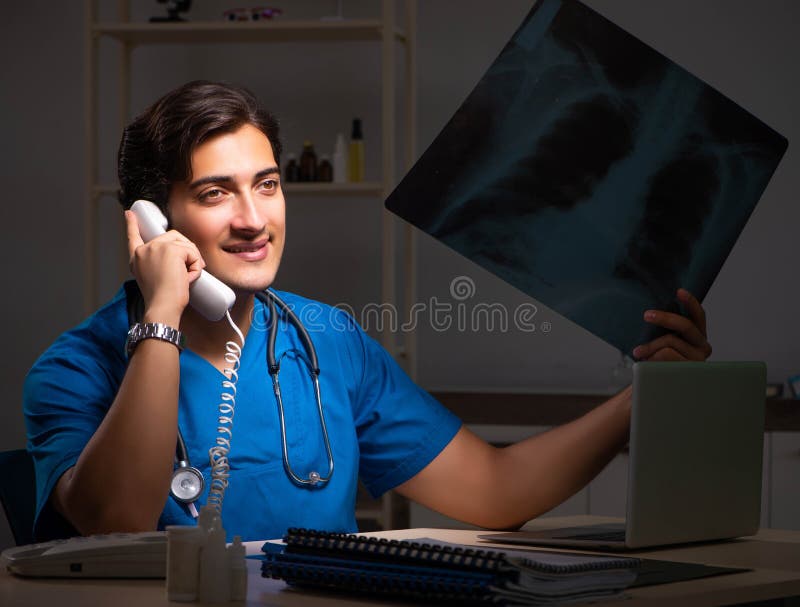 Young Handsome Doctor Working Night Shift in Hospital Stock Photo ...