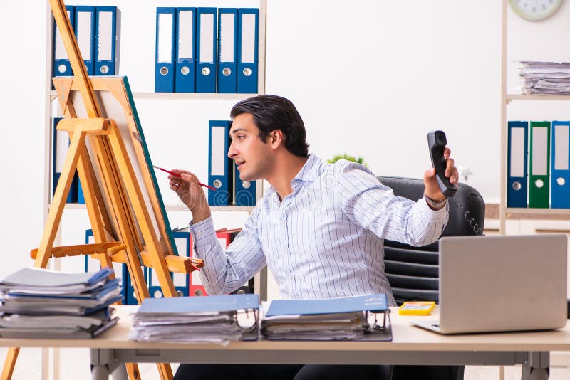 The Young Handsome Employee Enjoying Painting at the Office Stock Image ...