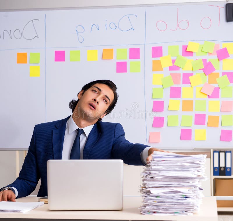 Young Handsome Employee in Front of Whiteboard with To-do List Stock ...