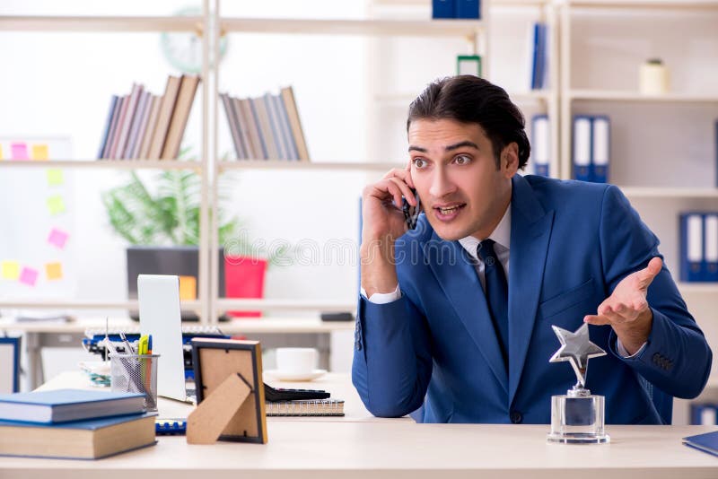 Young Handsome Employee in the Office Stock Photo - Image of report ...