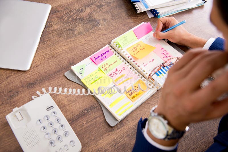 The Young Handsome Employee Planning His Work Activity Stock Image ...