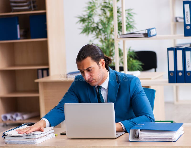 Young Handsome Employee Sitting in the Office Stock Image - Image of ...