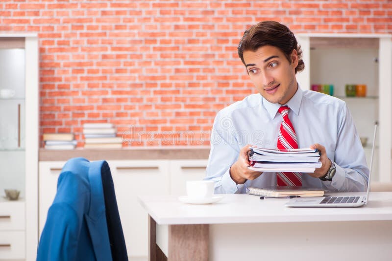 The Young Handsome Employee Working in the Office Stock Photo - Image ...