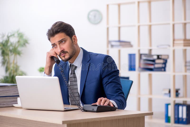Young Handsome Employee Working in the Office Stock Photo - Image of ...
