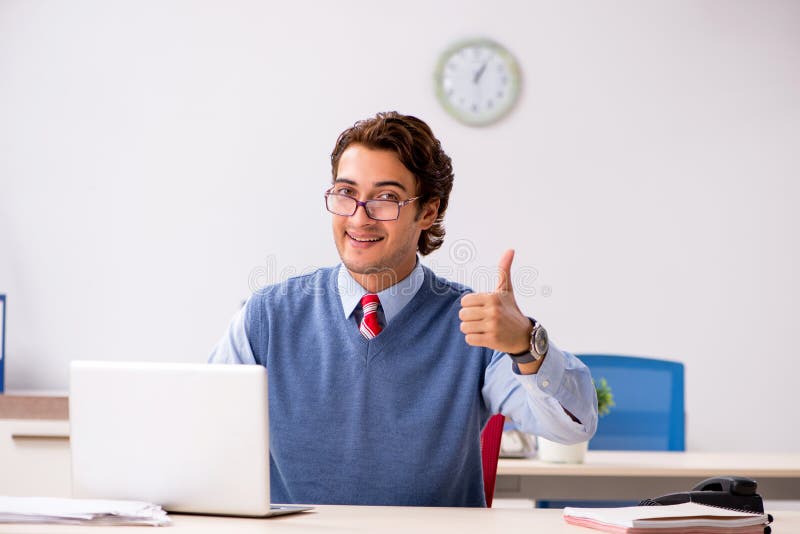 The Young Handsome Employee Working in the Office Stock Photo - Image ...