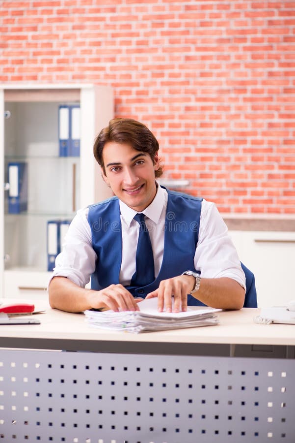 The Young Handsome Employee Working in the Office Stock Photo - Image ...