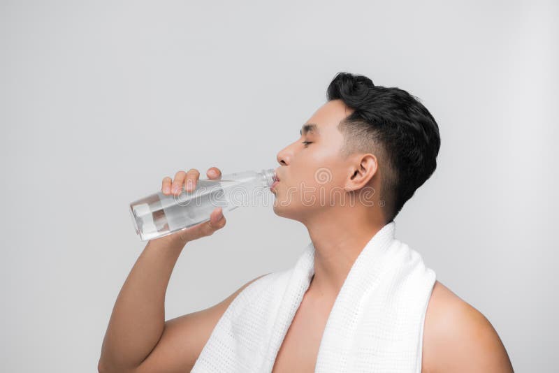 Young Handsome Fit Man Drinks Water / Male Model with Bottle of Water ...