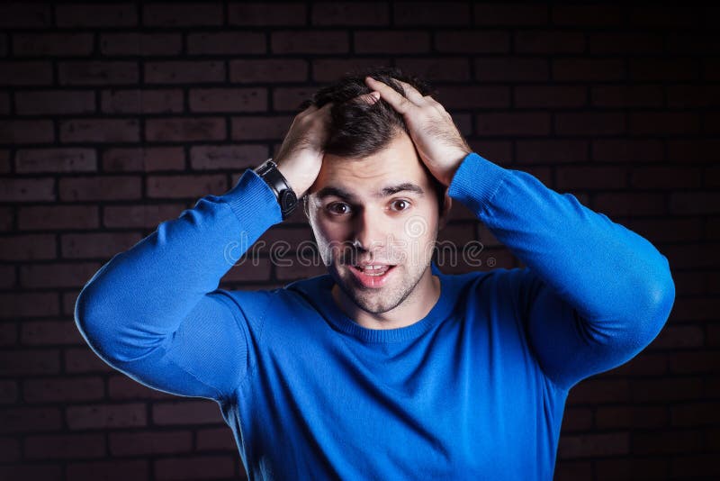 Young handsome guy scared stock image. Image of surprise - 67028135