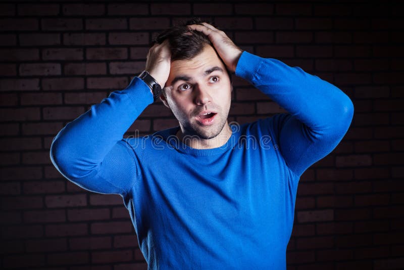 Young handsome guy scared stock photo. Image of oriented - 67028366