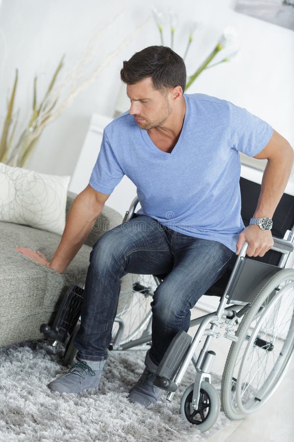 Young Handsome Disabled Paraplegic Man in Wheelchair Doing ...