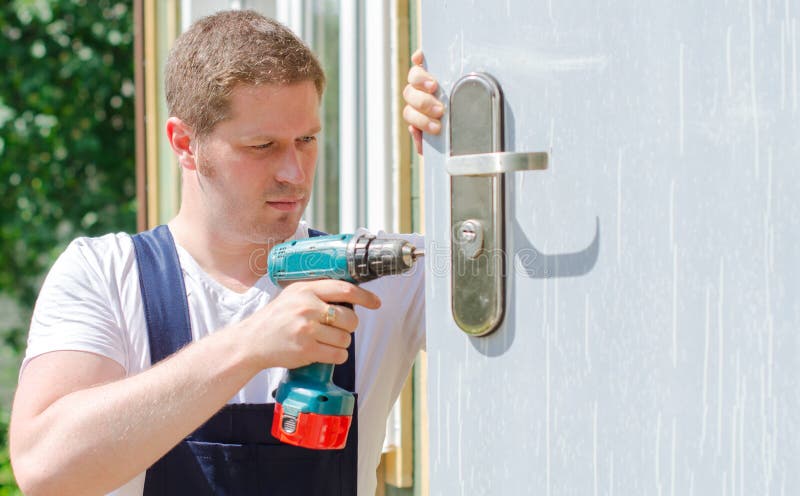 Young handsome handyman stock image. Image of door, handsome - 32575135