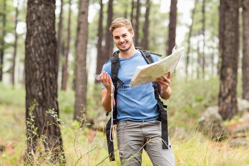 Young Handsome Hiker Using Map and Compass Stock Photo - Image of ...
