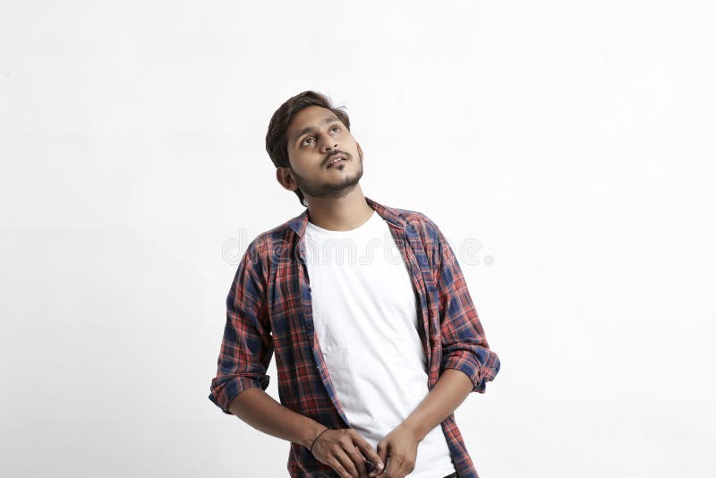 Young Handsome Indian College Student Giving Thinking Expression on ...