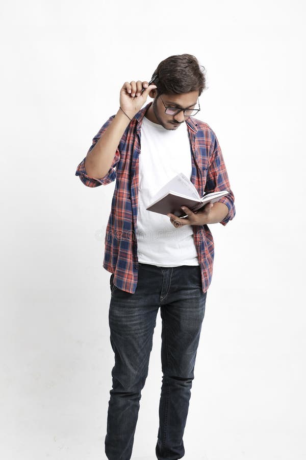 Young Handsome Indian College Student Giving Thinking Expression on ...