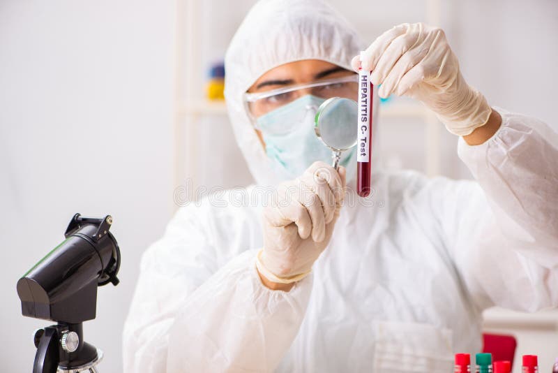 The Young Handsome Lab Assistant Testing Blood Samples in Hospital ...