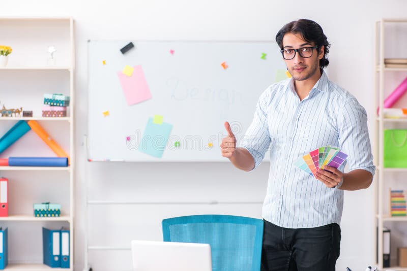 The Young Handsome Male Designer Working in the Office Stock Photo ...