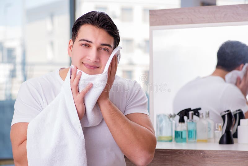 The Young Handsome Man Applying Face Cream Stock Photo - Image of ...