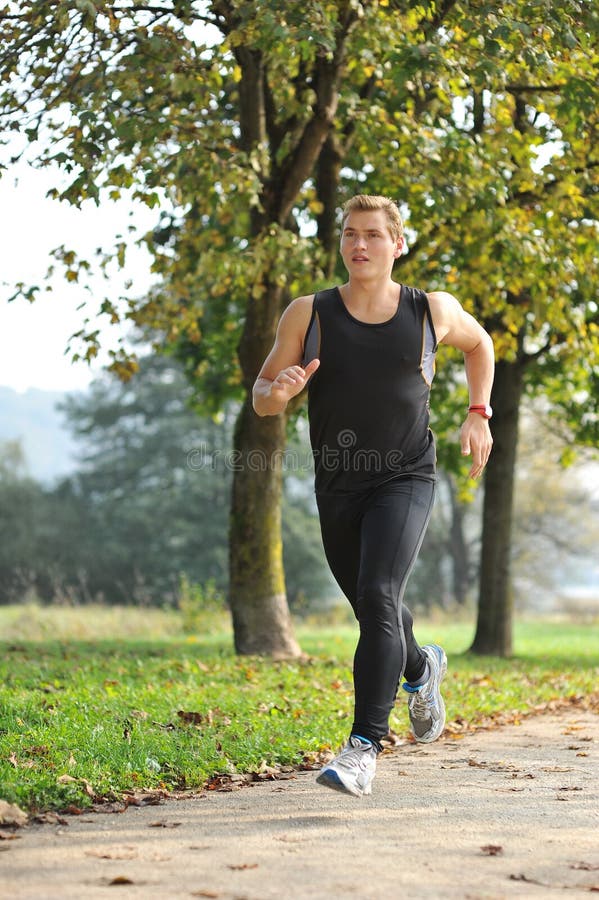 Young Handsome Man Athlete Running Stock Photo - Image of determination ...