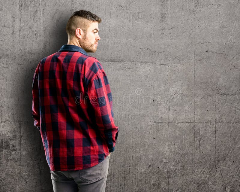 Young Handsome Man Over Wall Background Stock Image - Image of posing ...
