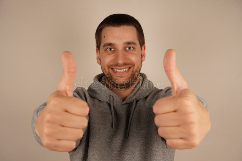 Young Handsome Man with Beard Over Isolated Gray Background Giving a ...