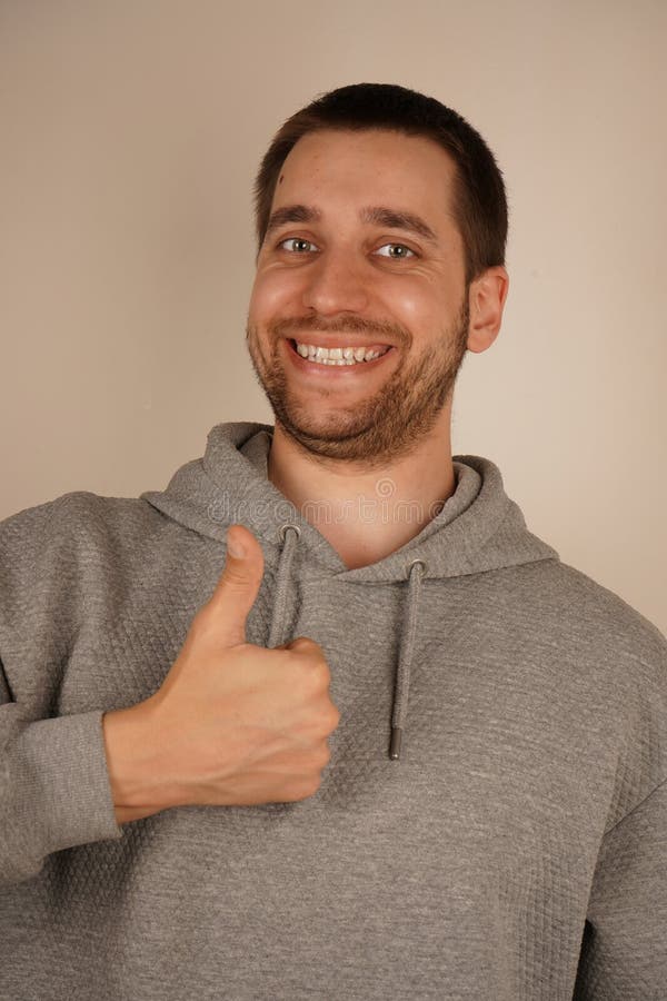 Young Handsome Man with Beard Over Isolated Gray Background Giving a ...
