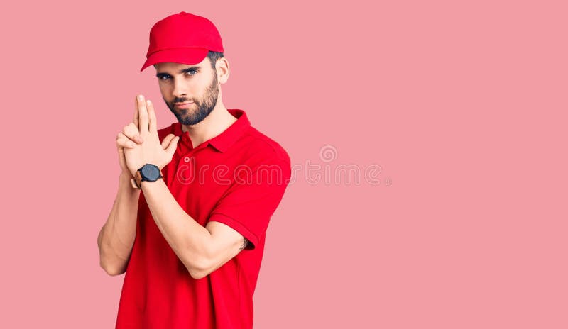 Young Handsome Man With Beard Wearing Delivery Uniform Holding Symbolic