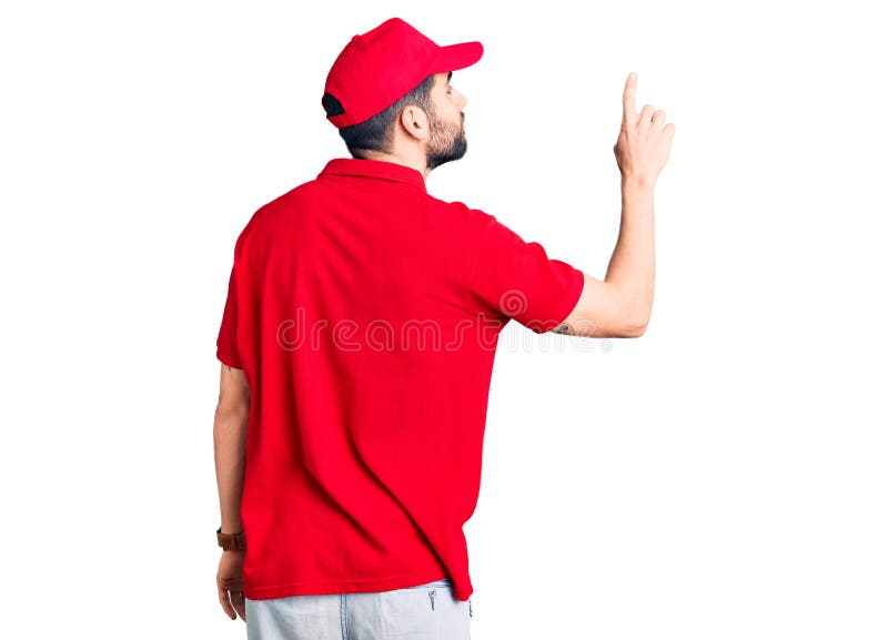 Young Handsome Man With Beard Wearing Delivery Uniform Posing Backwards