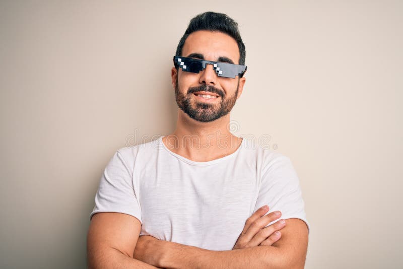Young Handsome Man With Beard Wearing Funny Thug Life Sunglasses Over