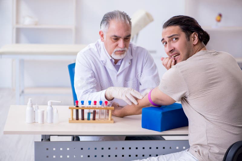 Young Handsome Man during Blood Test Sampling Procedure Stock Image ...