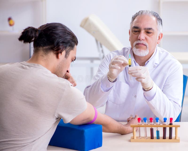 Young Handsome Man during Blood Test Sampling Procedure Stock Photo ...